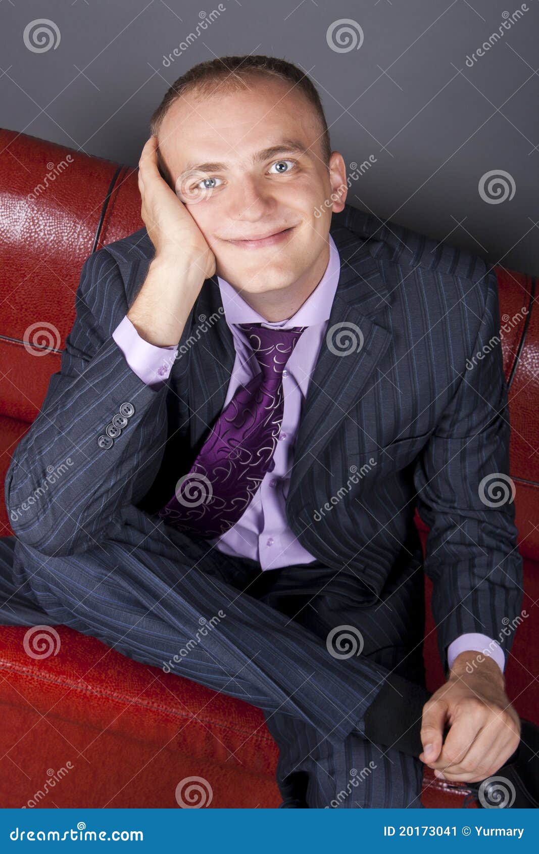 Thoughtful Guy in a Suit Sitting on a Red Couch Stock Image - Image of ...