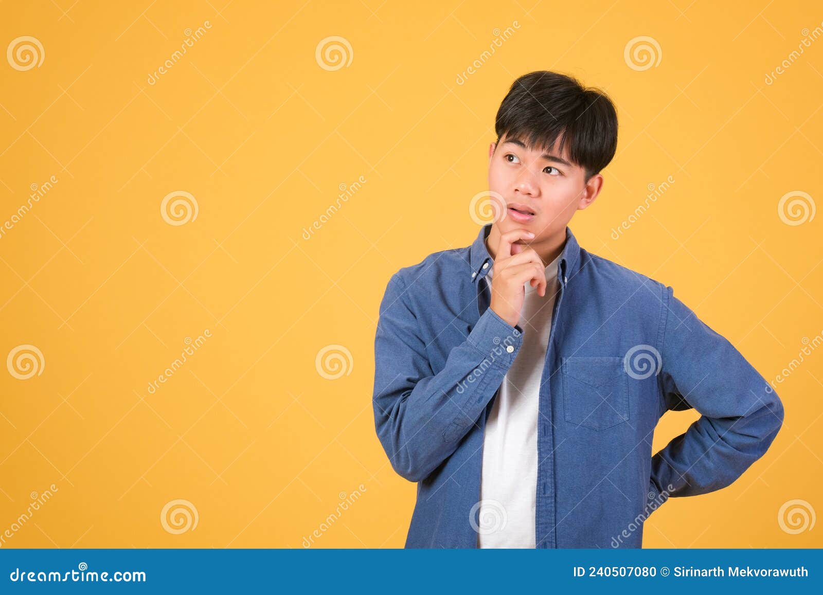 Thoughtful Handsome Young Man Standing and Thinking. Stock Photo ...