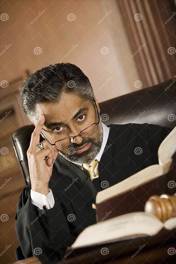 Thoughtful Judge with Book stock image. Image of judgment - 29663139
