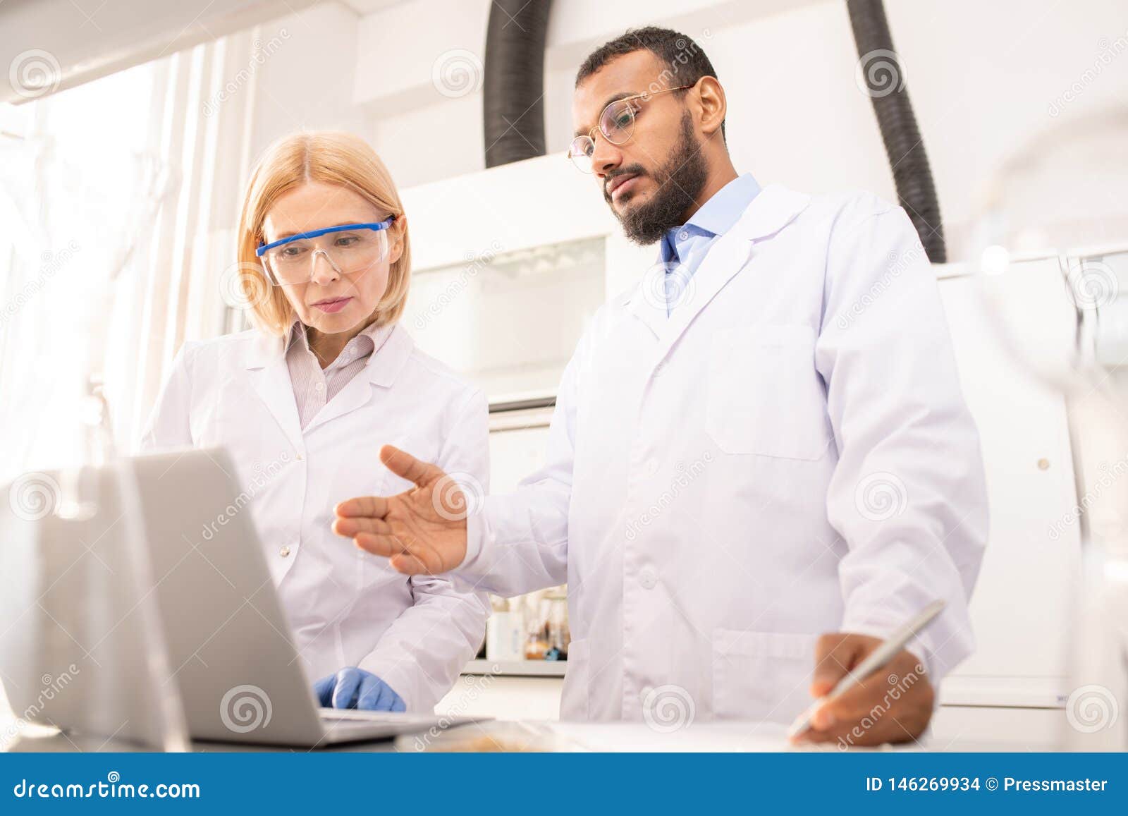 Thoughtful Laboratory Colleagues Finding Solution Stock Photo - Image ...