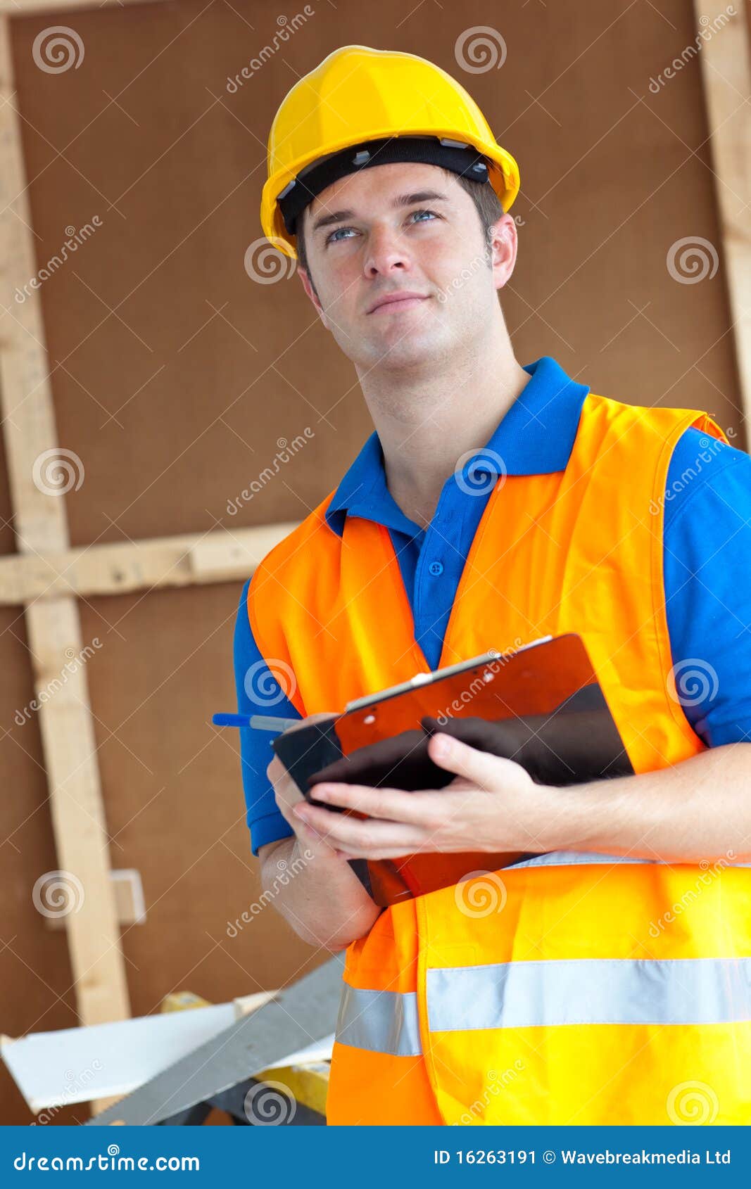 Thoughtful Male Worker Holding a Clipboard Stock Image - Image of ...