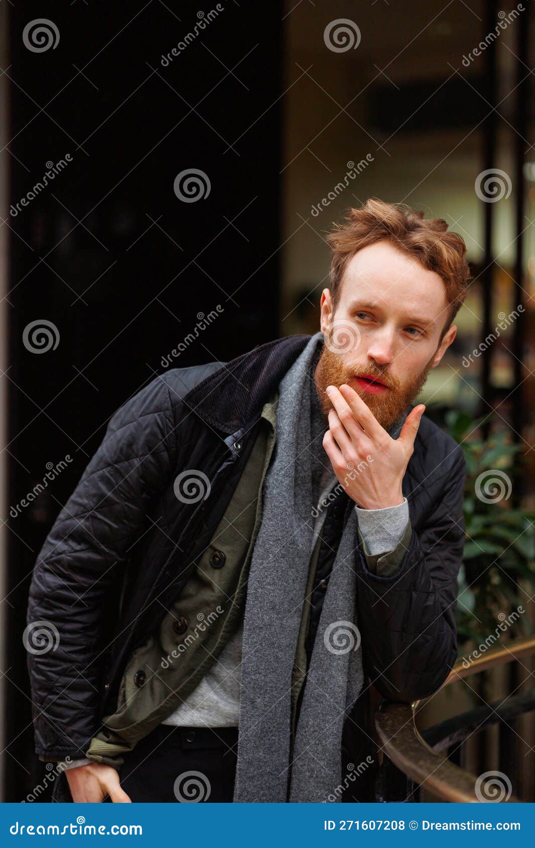 Thoughtful Man Posing Outdoors Leaning Against the Railing. Stock Photo ...