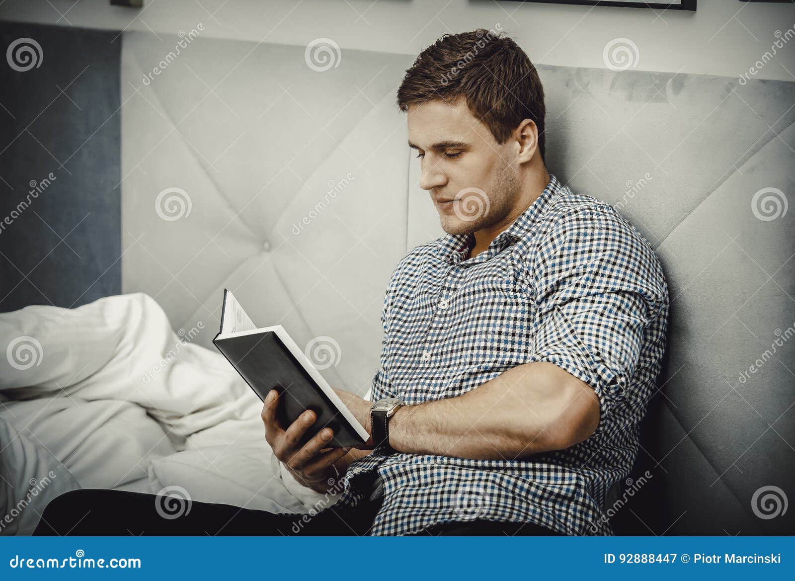 Thoughtful Man Reading a Note in His Bed. Stock Image - Image of room ...