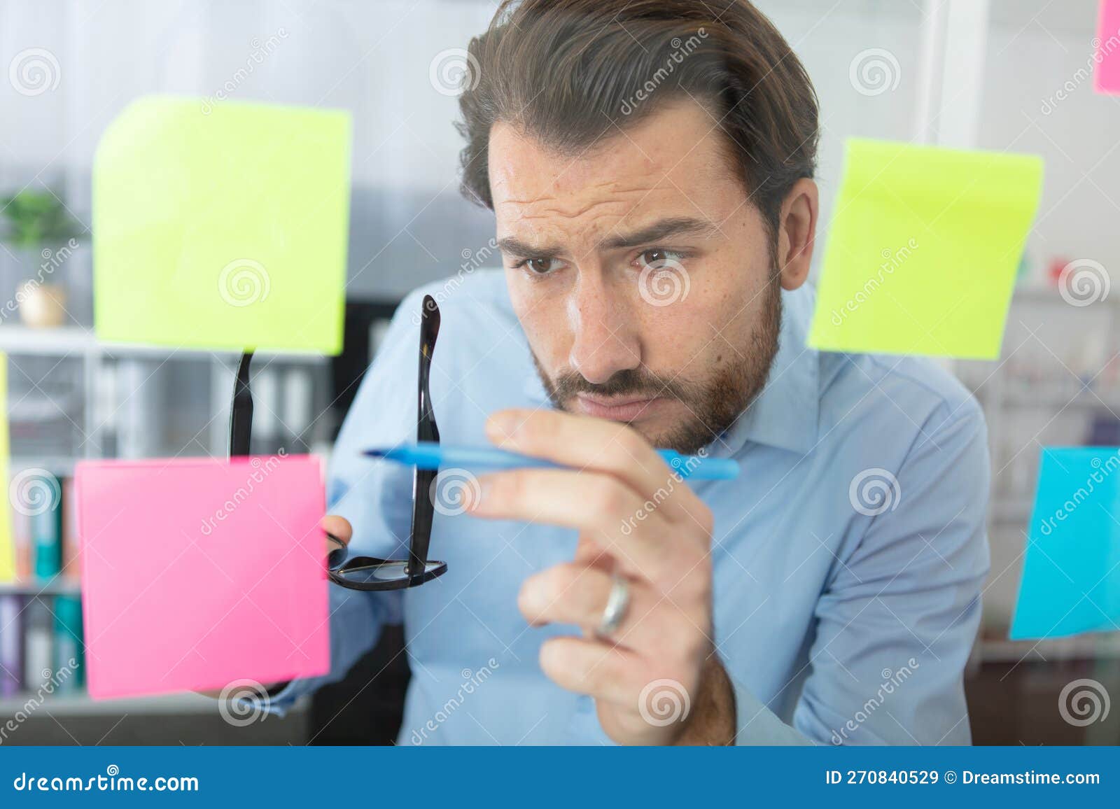 Thoughtful Man Reading Sticky Notes in Office Stock Image - Image of ...