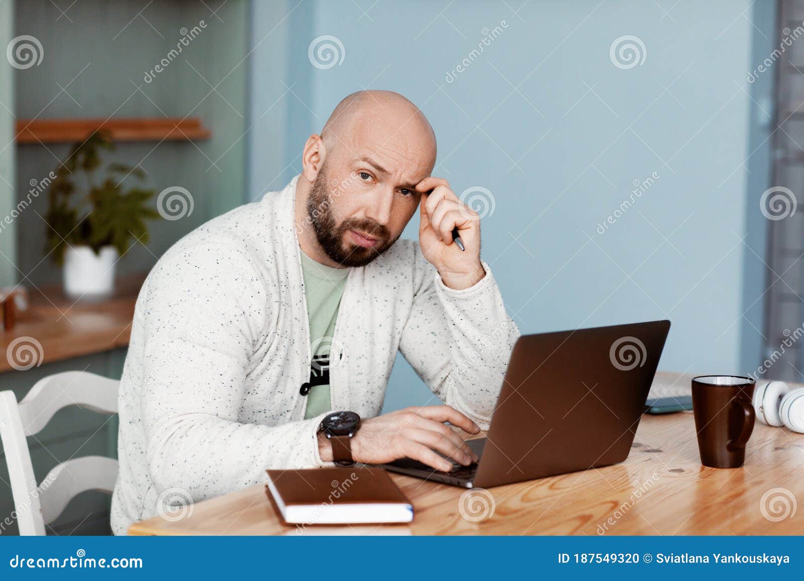 Thoughtful Man is Typing on a Laptop. a Businessman is Thinking about a ...