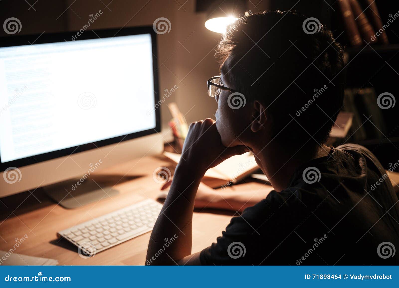 Thoughtful Man Working with Blank Screen Computer in Dark Room Stock ...