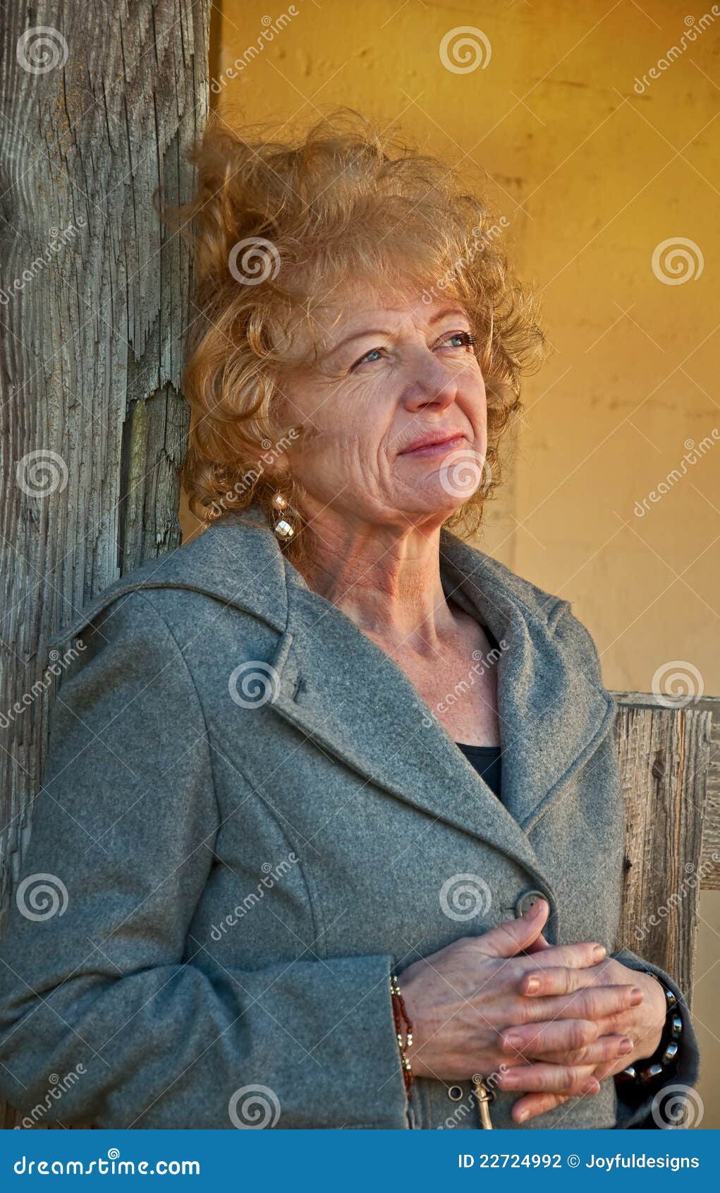 Thoughtful Middle Aged Woman in Rustic Setting Stock Photo - Image of ...