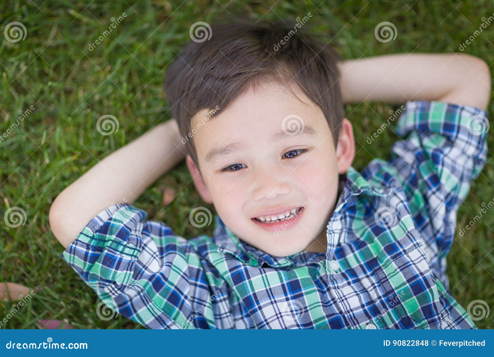 Thoughtful Mixed Race Chinese and Caucasian Young Boy Relaxing O Stock ... Thoughtful Mixed Race Chinese and Caucasian Young Boy Relaxing O Stock ...