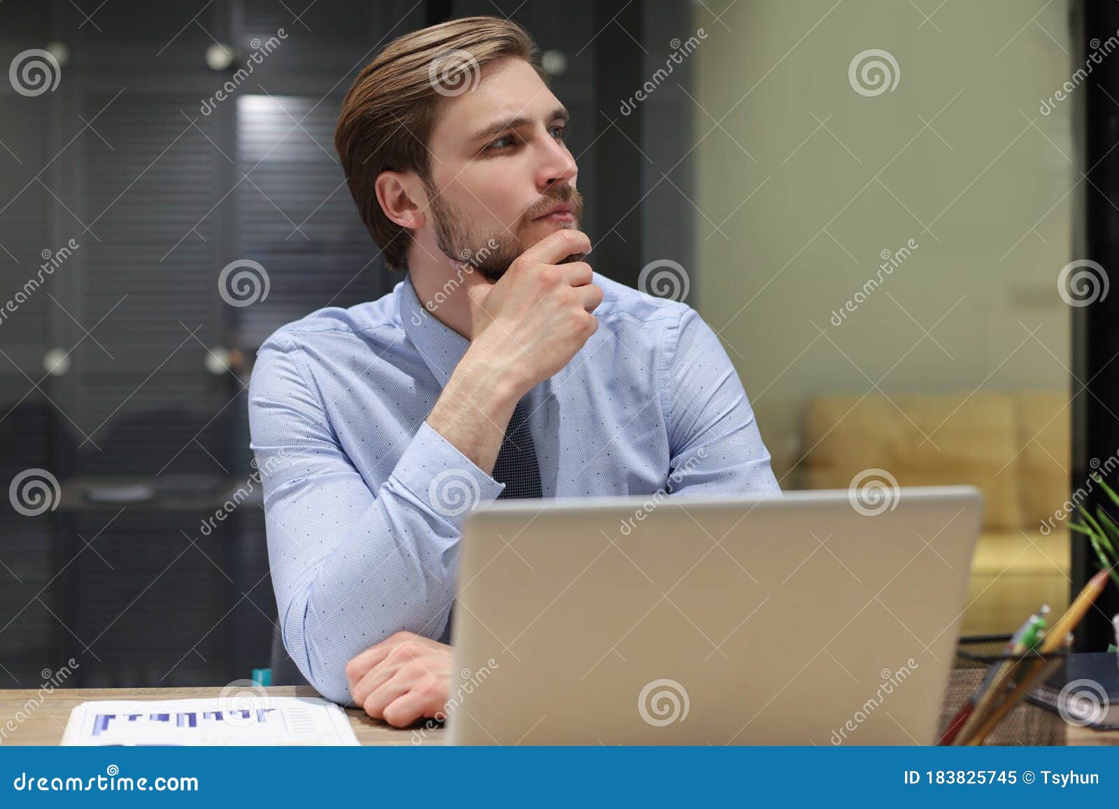 Thoughtful Modern Business Man Working Using Laptop while Sitting in ...