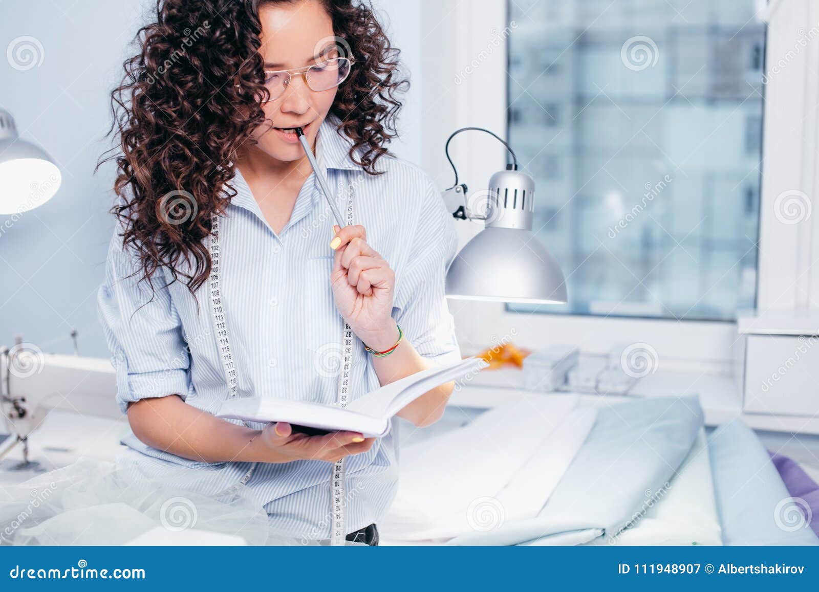 Pretty Tailor Clenching Pencil on Teeth Stock Image - Image of making ...