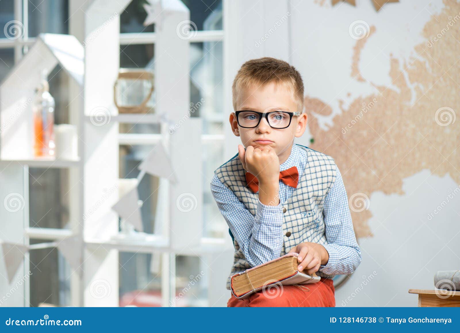 A Thoughtful Schoolboy Sits at a Desk with Books Stock Photo - Image of ... A Thoughtful Schoolboy Sits at a Desk with Books Stock Photo - Image of ...