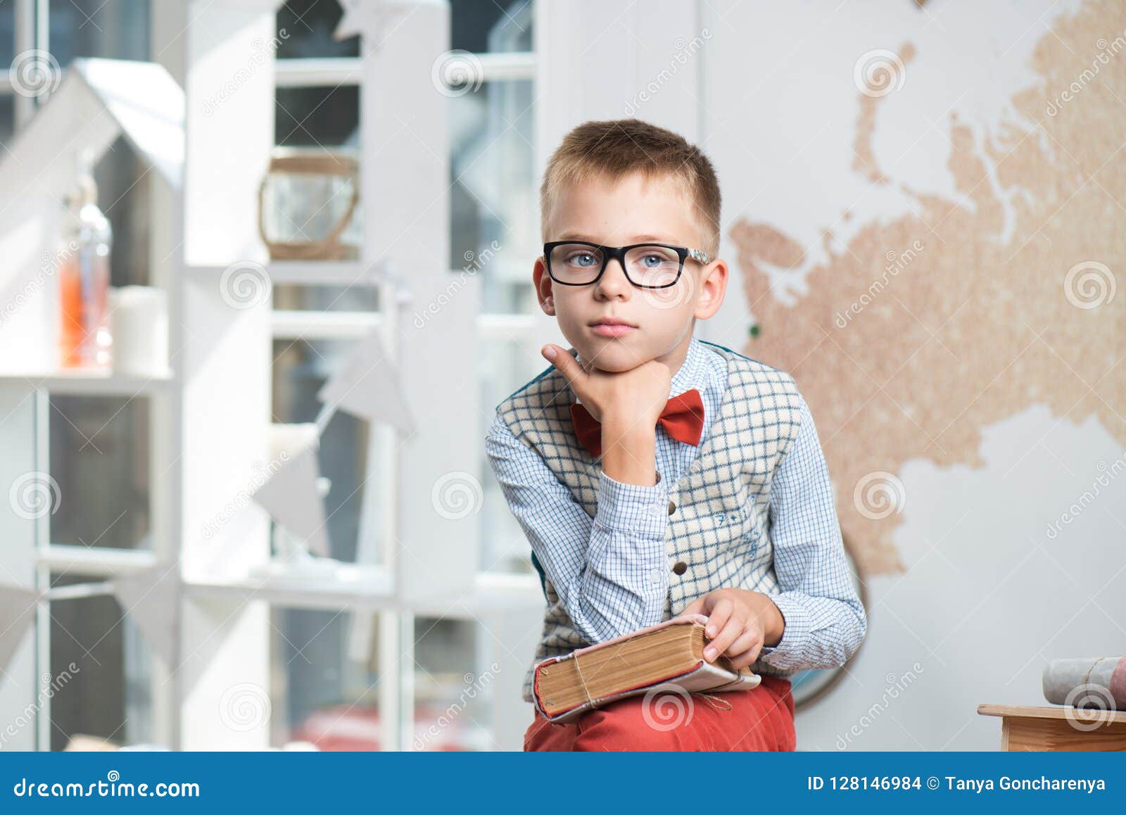 A Thoughtful Schoolboy Sits at a Desk with Books Stock Photo - Image of ... A Thoughtful Schoolboy Sits at a Desk with Books Stock Photo - Image of ...