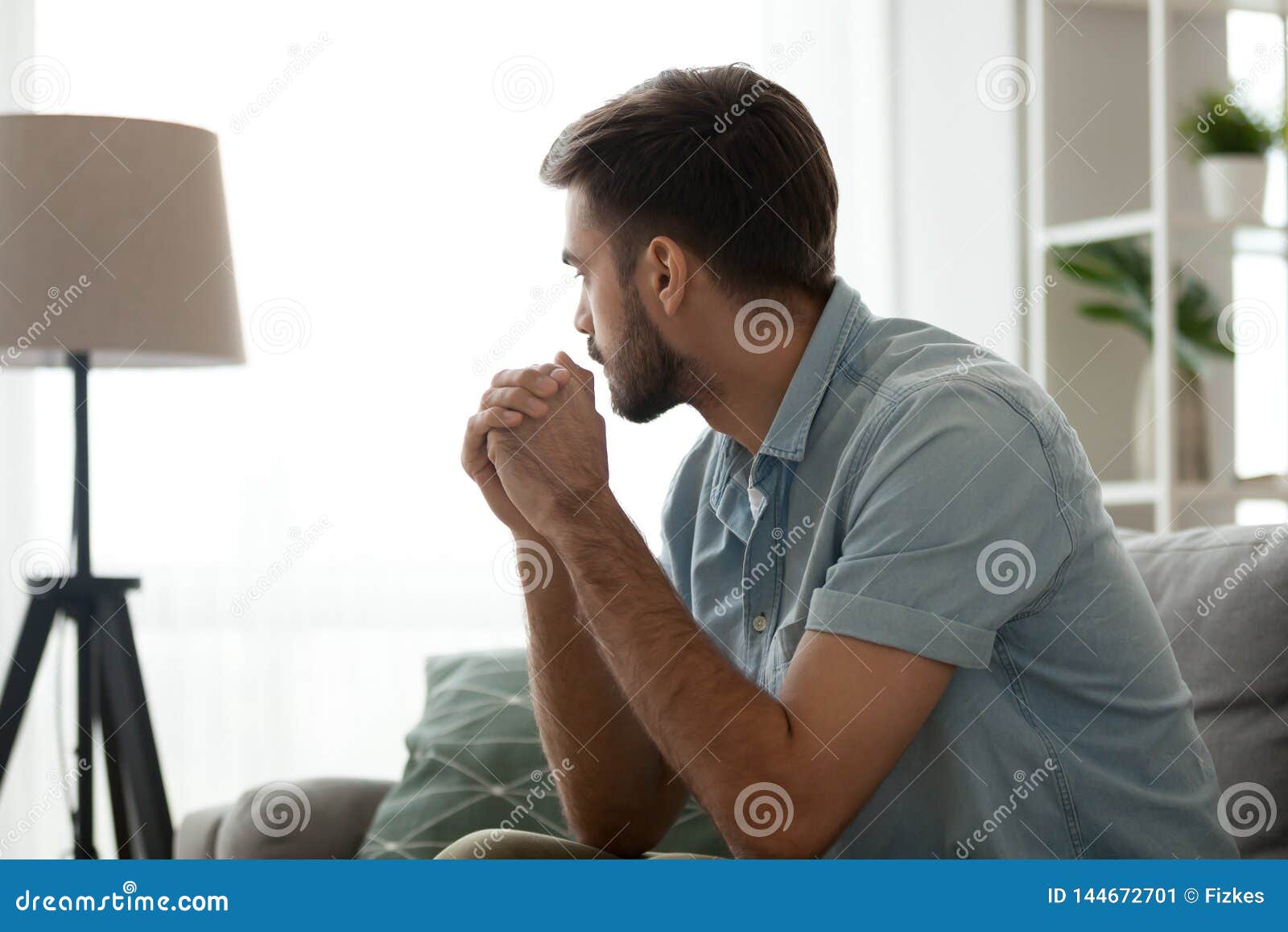 Thoughtful Serious Man Sitting On Sofa At Home, Lost In Thoughts ... Thoughtful Serious Man Sitting On Sofa At Home, Lost In Thoughts ...
