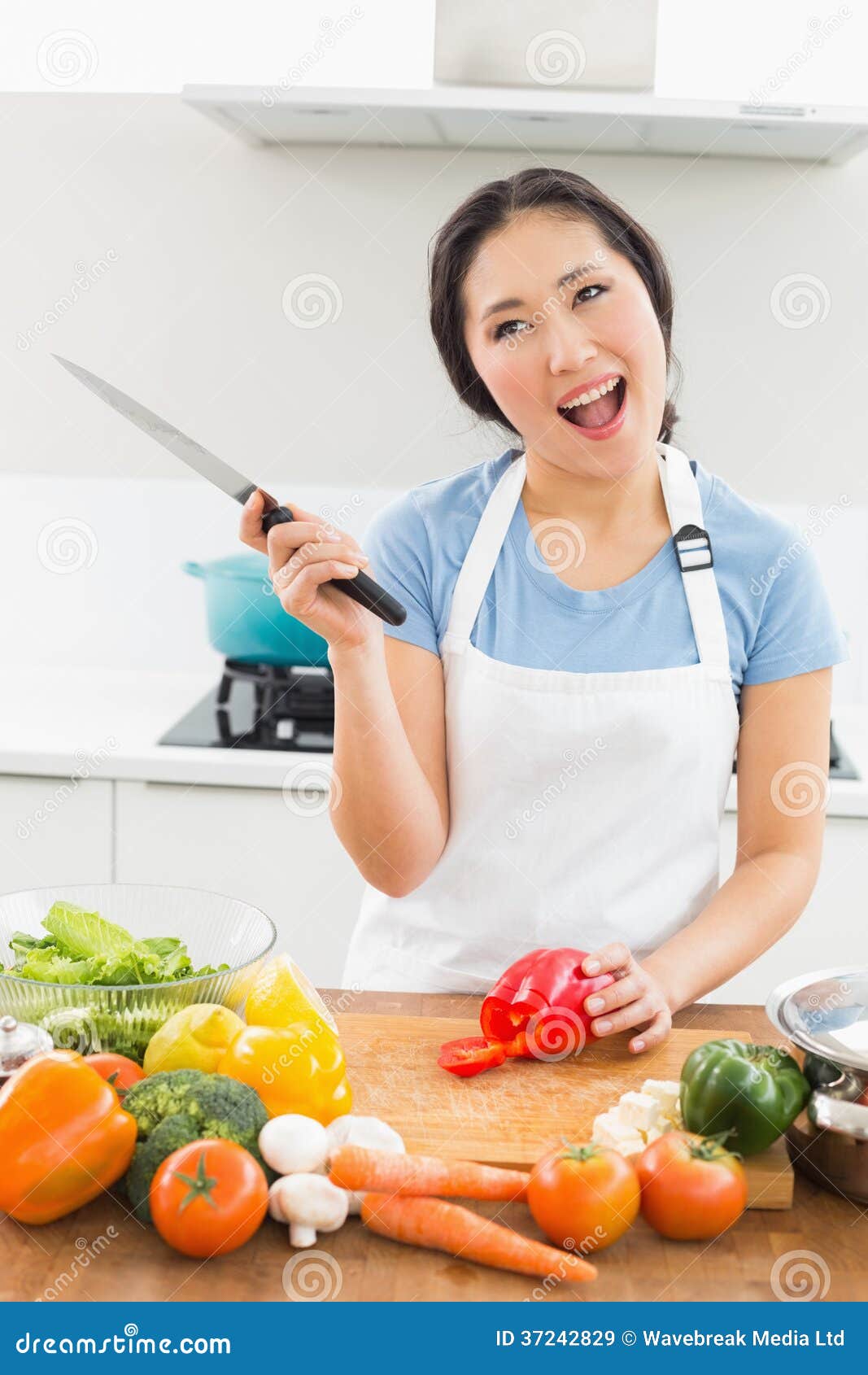 Thoughtful Smiling Woman Chopping Vegetables in Kitchen Stock Image ...