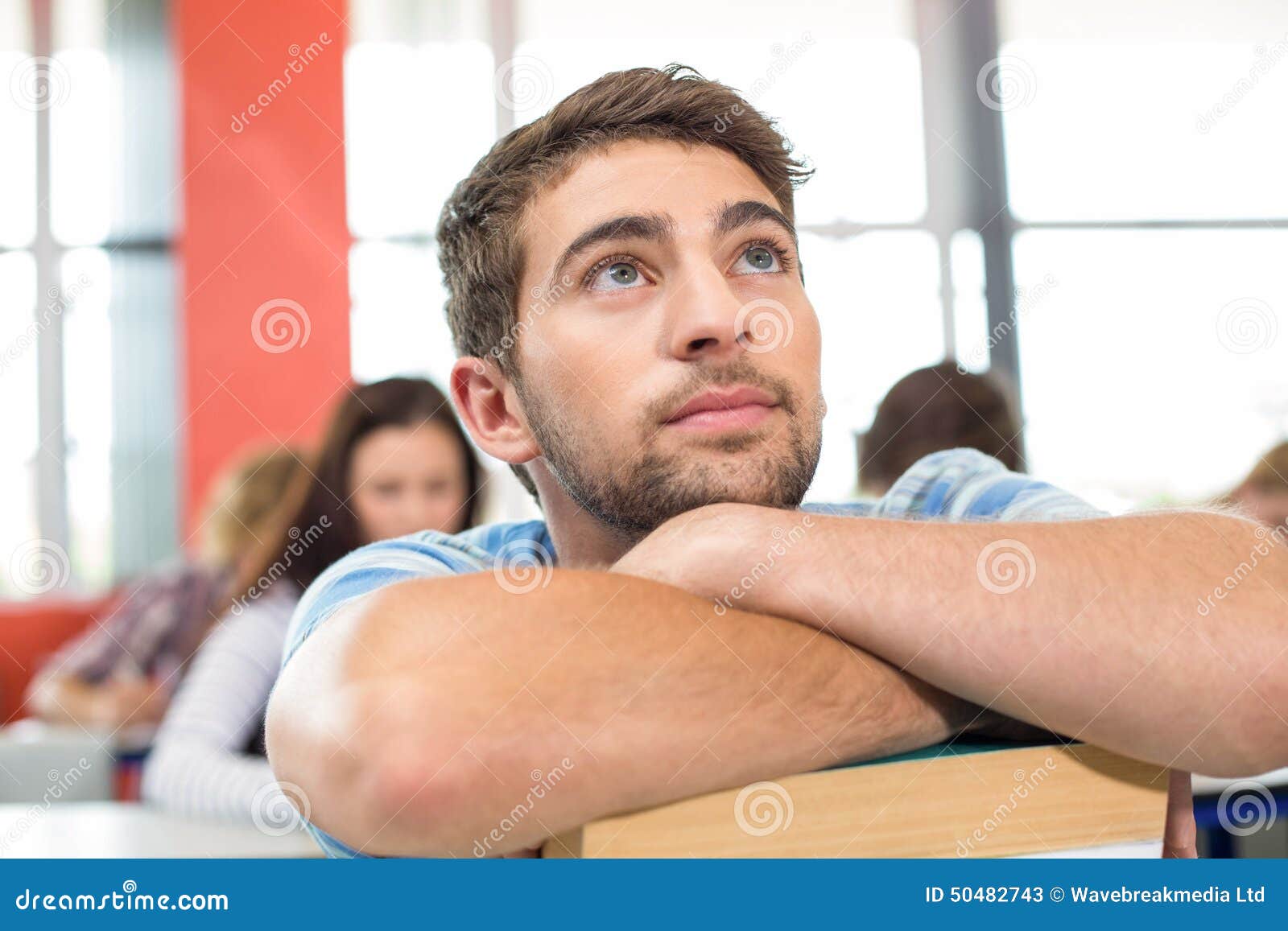 Thoughtful Student with Books in Classroom Stock Image - Image of notes ...