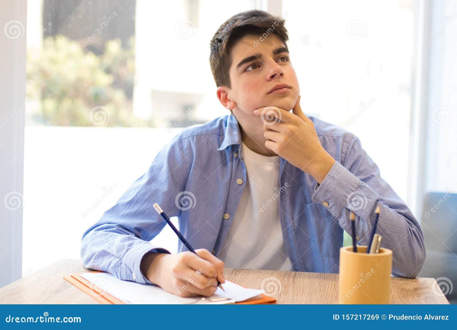Student at the desk stock image. Image of classroom - 157217269