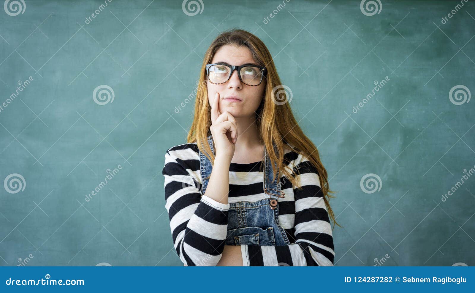 Thoughtful Student Girl on Green Chalkboard Stock Photo - Image of ...