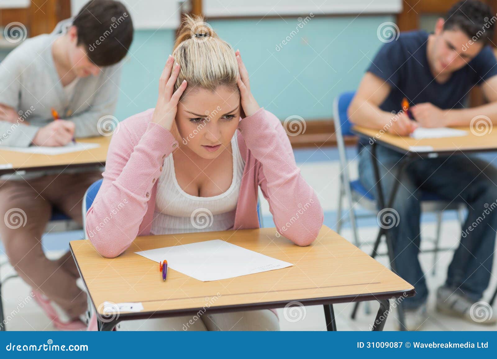 Thoughtful Student Sitting in Classroom Stock Image - Image of college ...