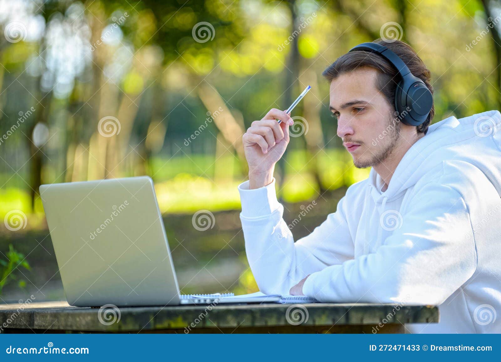Young Guy is Studying Outdoors Sitting in the Park Stock Image - Image ...