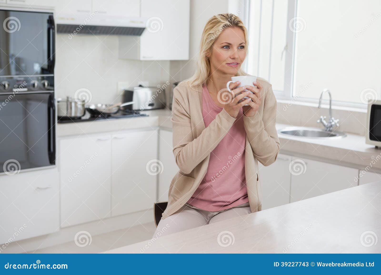Thoughtful Woman Drinking Coffee in Kitchen Stock Image - Image of ...