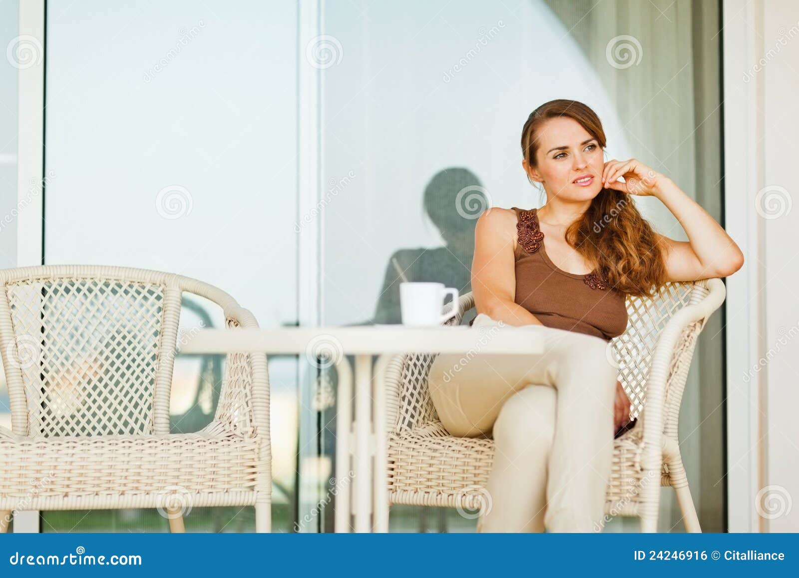Thoughtful Woman Sitting on Terrace Stock Photo - Image of life, casual ...