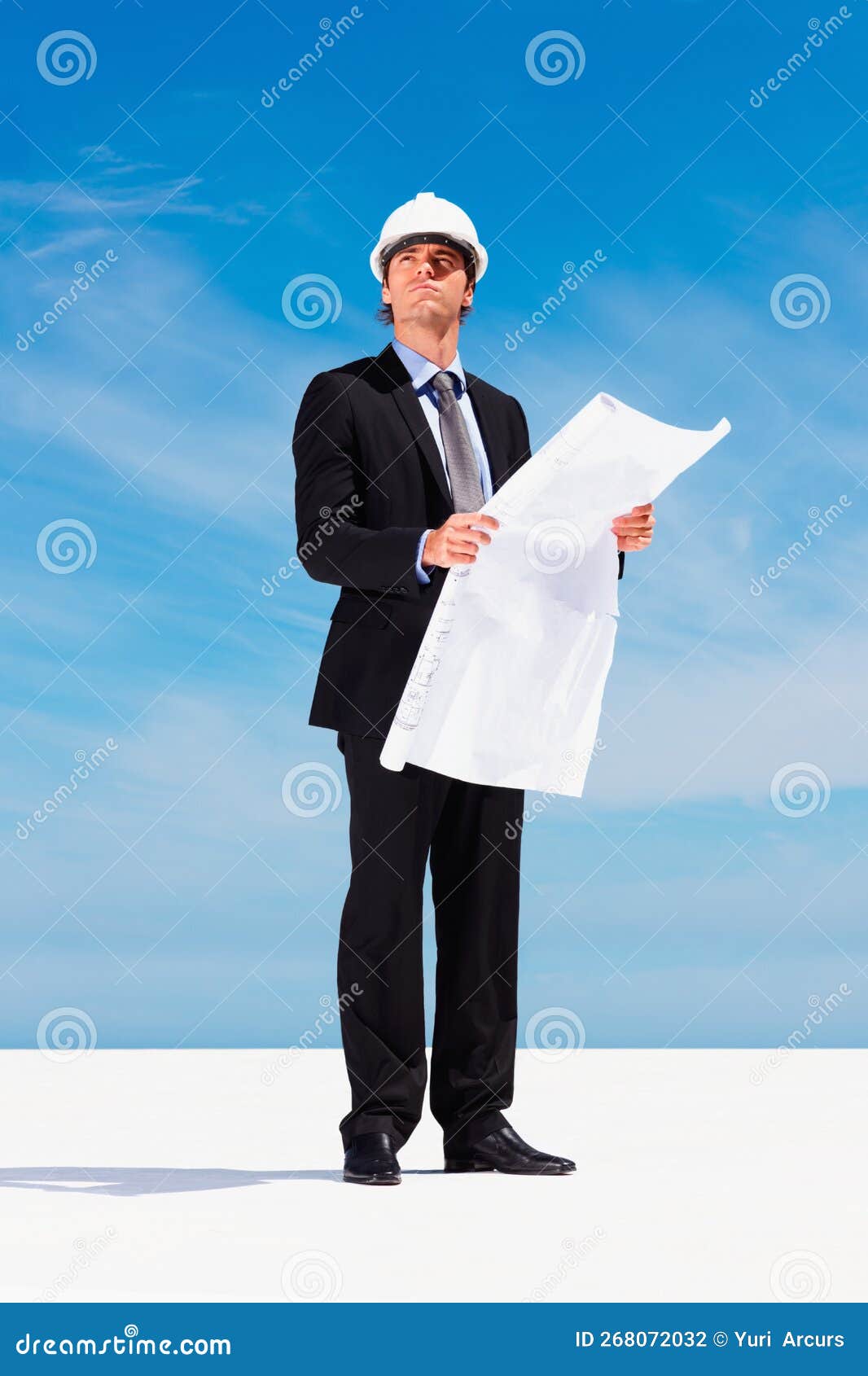 Thoughtful Young Architect Holding a Blueprint. Portrait of Thoughtful ... Thoughtful Young Architect Holding a Blueprint. Portrait of Thoughtful ...