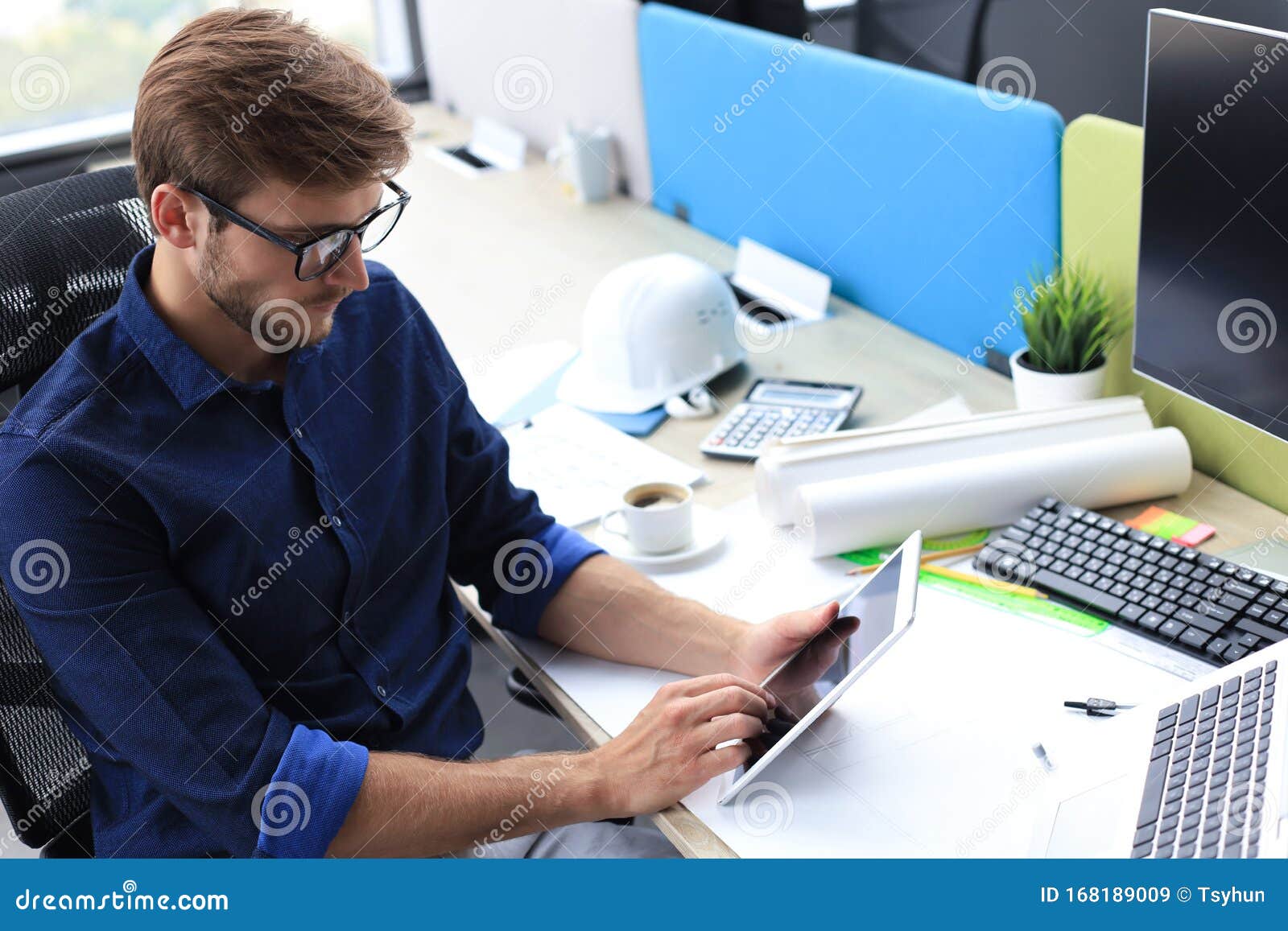 Thoughtful Young Business Man Working Using Computer while Standing in ...