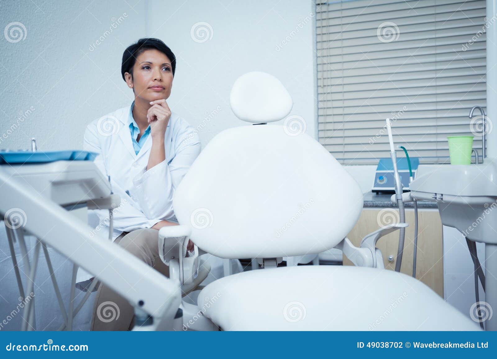 Thoughtful Young Female Dentist Stock Photo - Image of dentist, front ...
