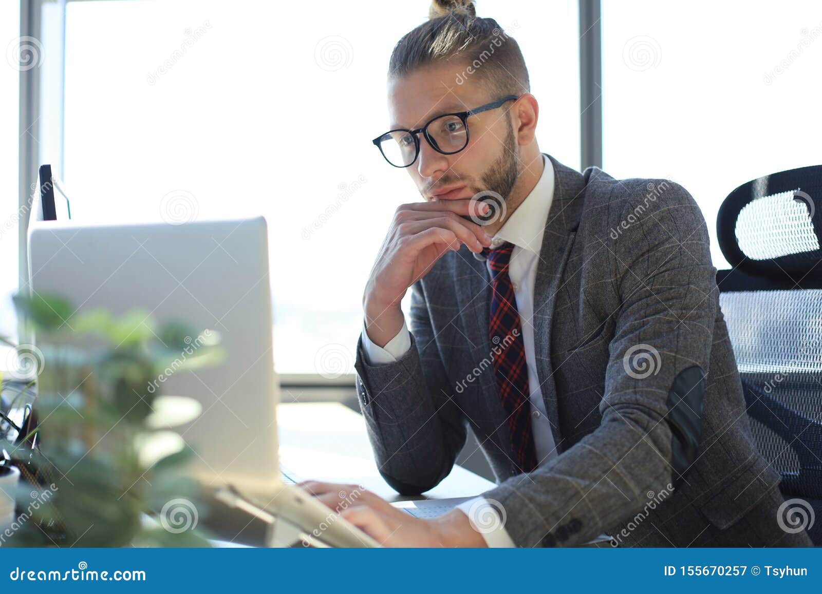 Thoughtful Young Man in Full Suit Working Using Computer while Sitting ...