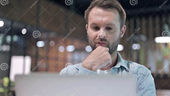 Thoughtful Young Man Thinking at Work Stock Photo - Image of ...