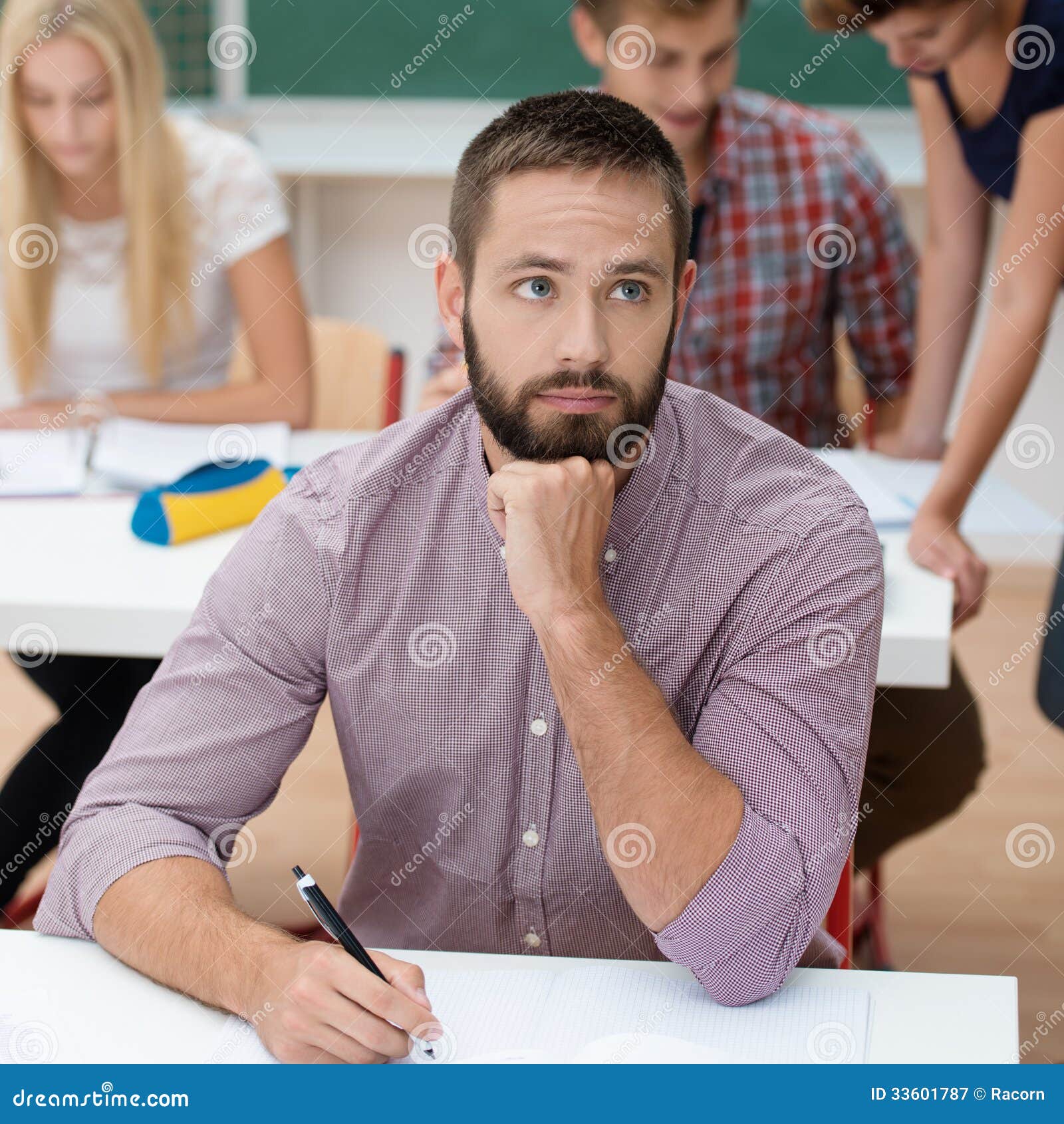 Thoughtful Young Man In A University Class Stock Image - Image: 33601787 Thoughtful Young Man In A University Class Stock Image - Image: 33601787