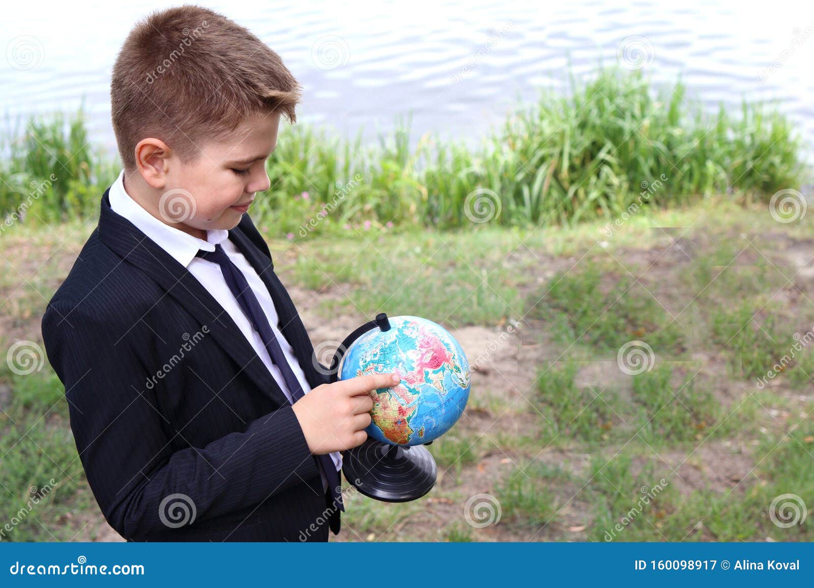 Schoolboy Looks at the Globe and Dreams in Nature Stock Image - Image ...