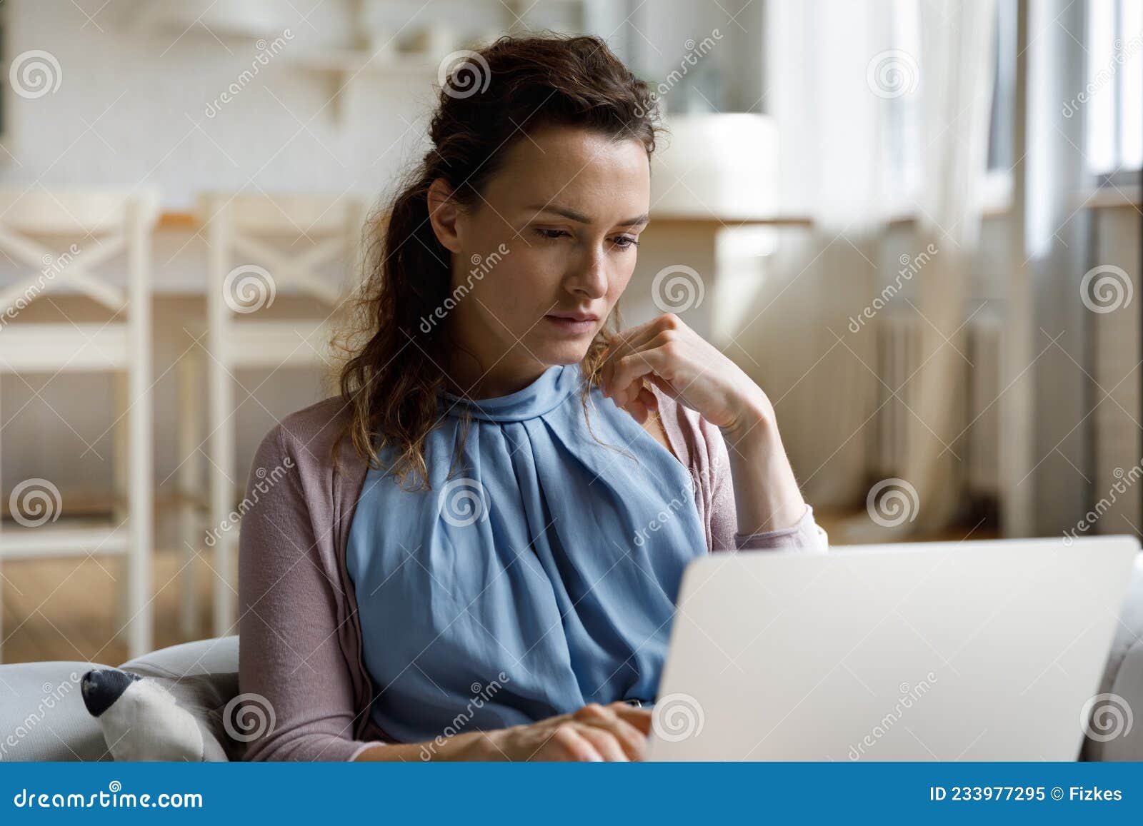 Thoughtful Young Woman Looking at Computer Screen. Stock Image - Image ...