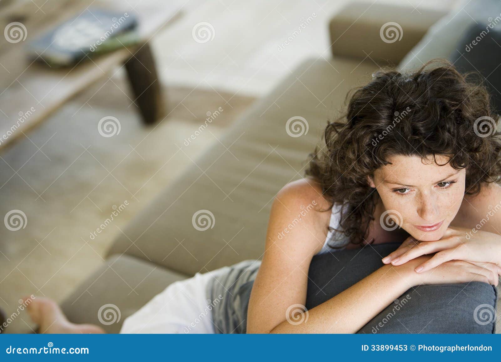 Thoughtful Young Woman Sitting on Couch Stock Image - Image of people ...