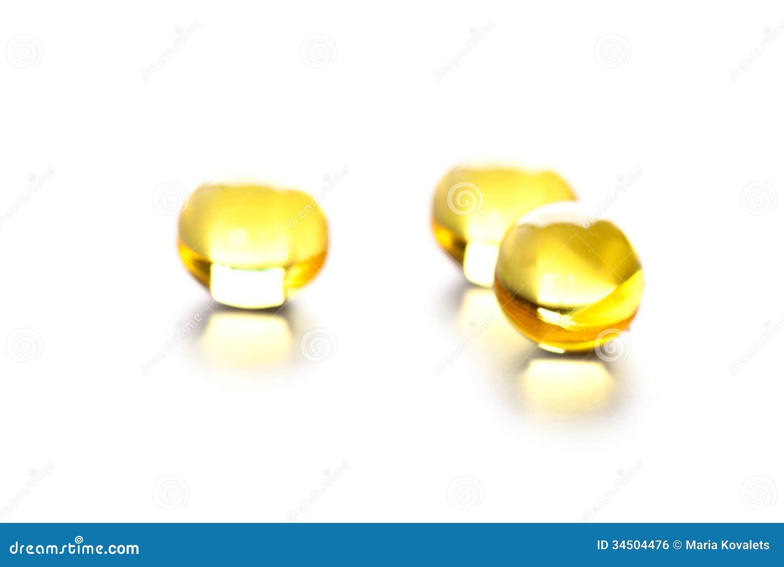 Yellow Gelatin Capsules With A Small Drug Omega-3, In A Wooden Spoon ...