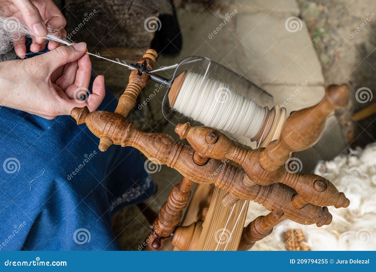 The Thread Maker Makes the Thread on the Spinning Wheel Stock Image ...