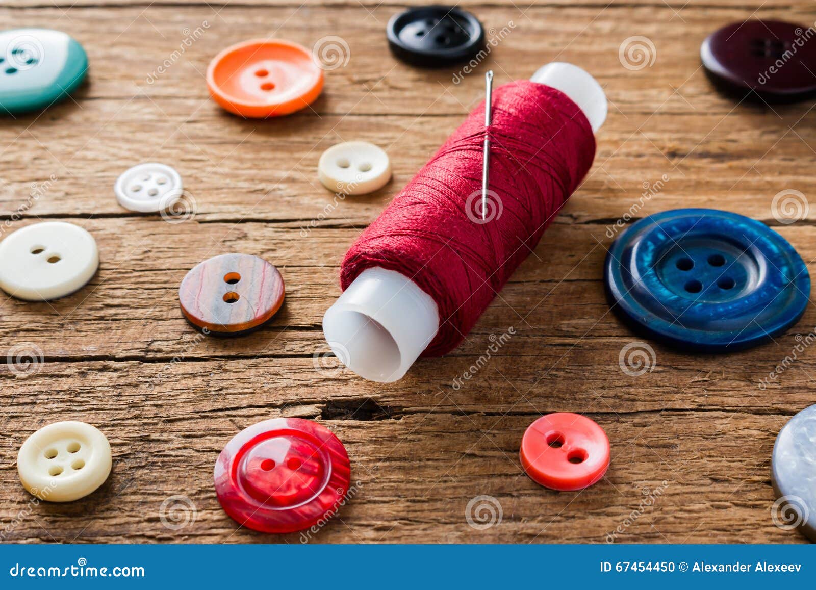Thread with a Needle on the Background of Buttons Stock Photo - Image ...