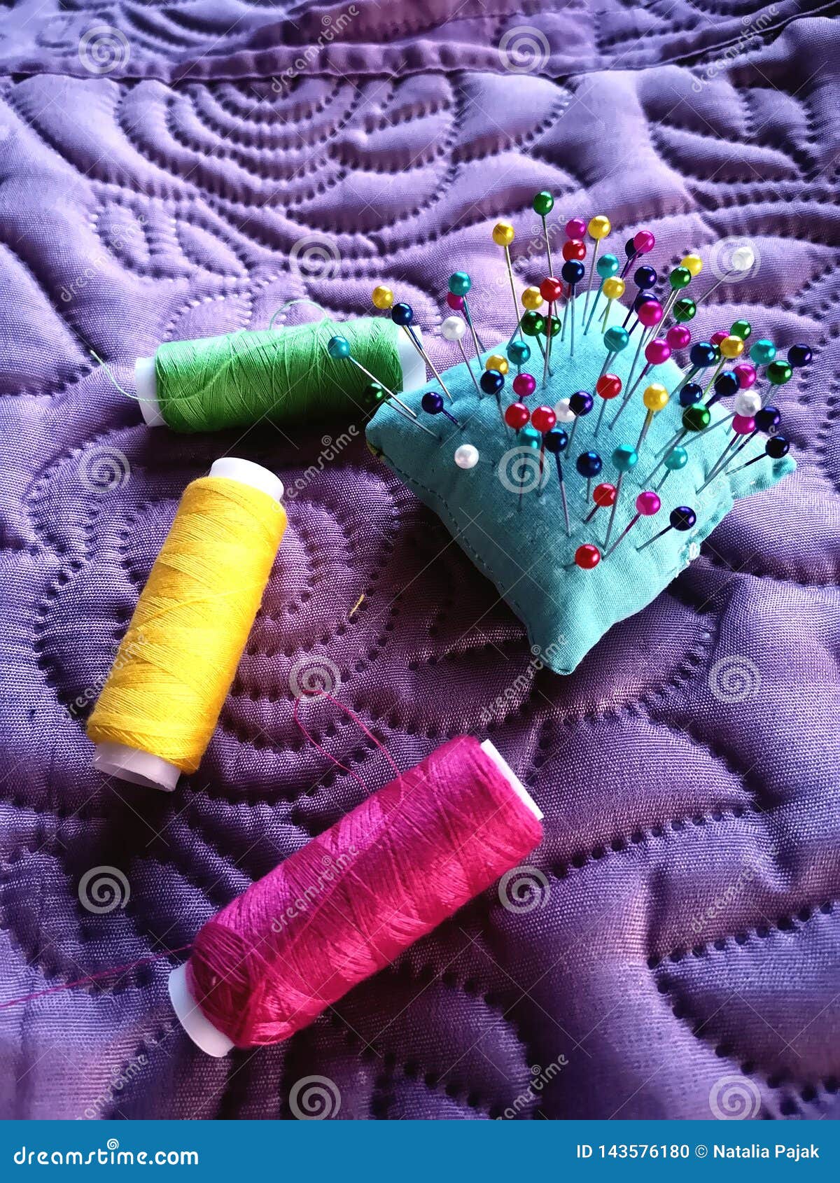 Colored Thread , Pins on a Purple Fabric. Stock Photo - Image of green ...
