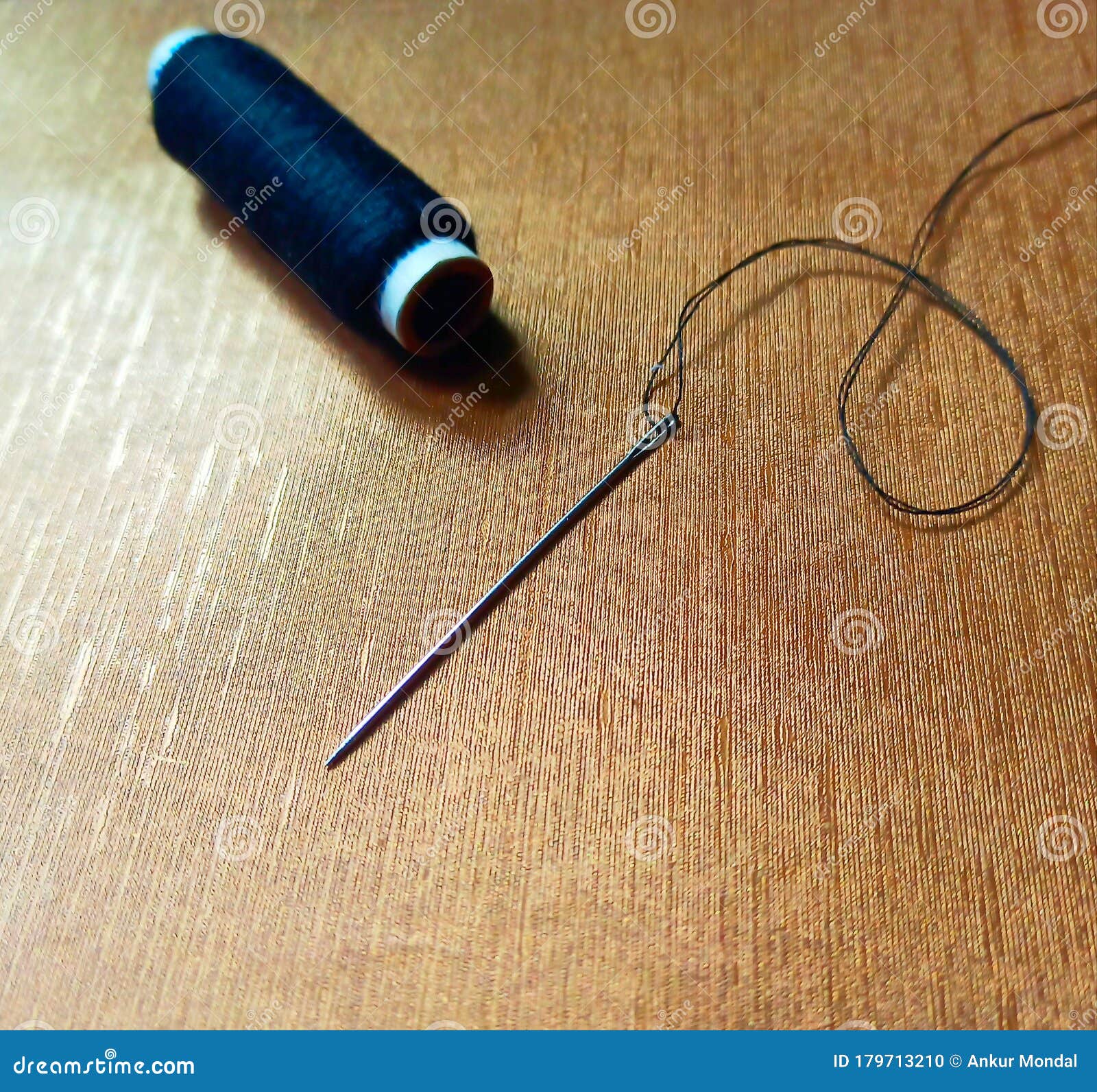 Thread Reel and Needle Used for Sewing and Stitching Stock Photo ...