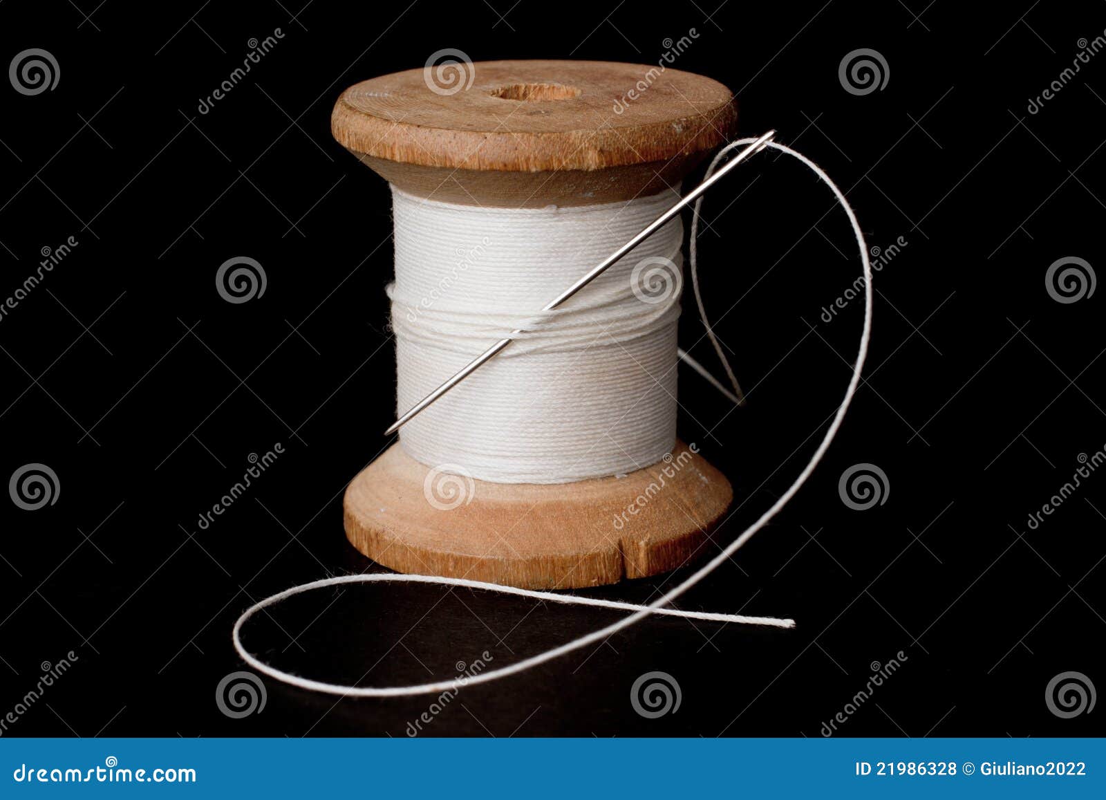 Thread spool and needle stock photo. Image of thread - 21986328