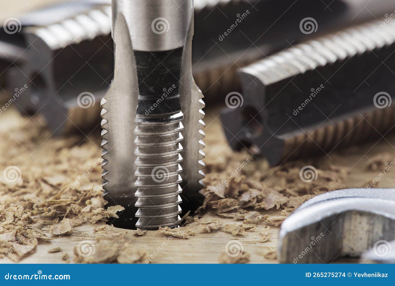 Thread Tap Drill Cutting Hole in Wooden Plate. Working Cutter Stock ...