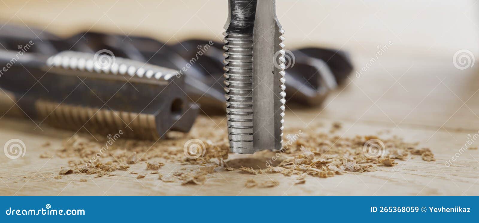Thread Tap Drill Cutting Hole in Wooden Plate. Working Cutter Stock ...