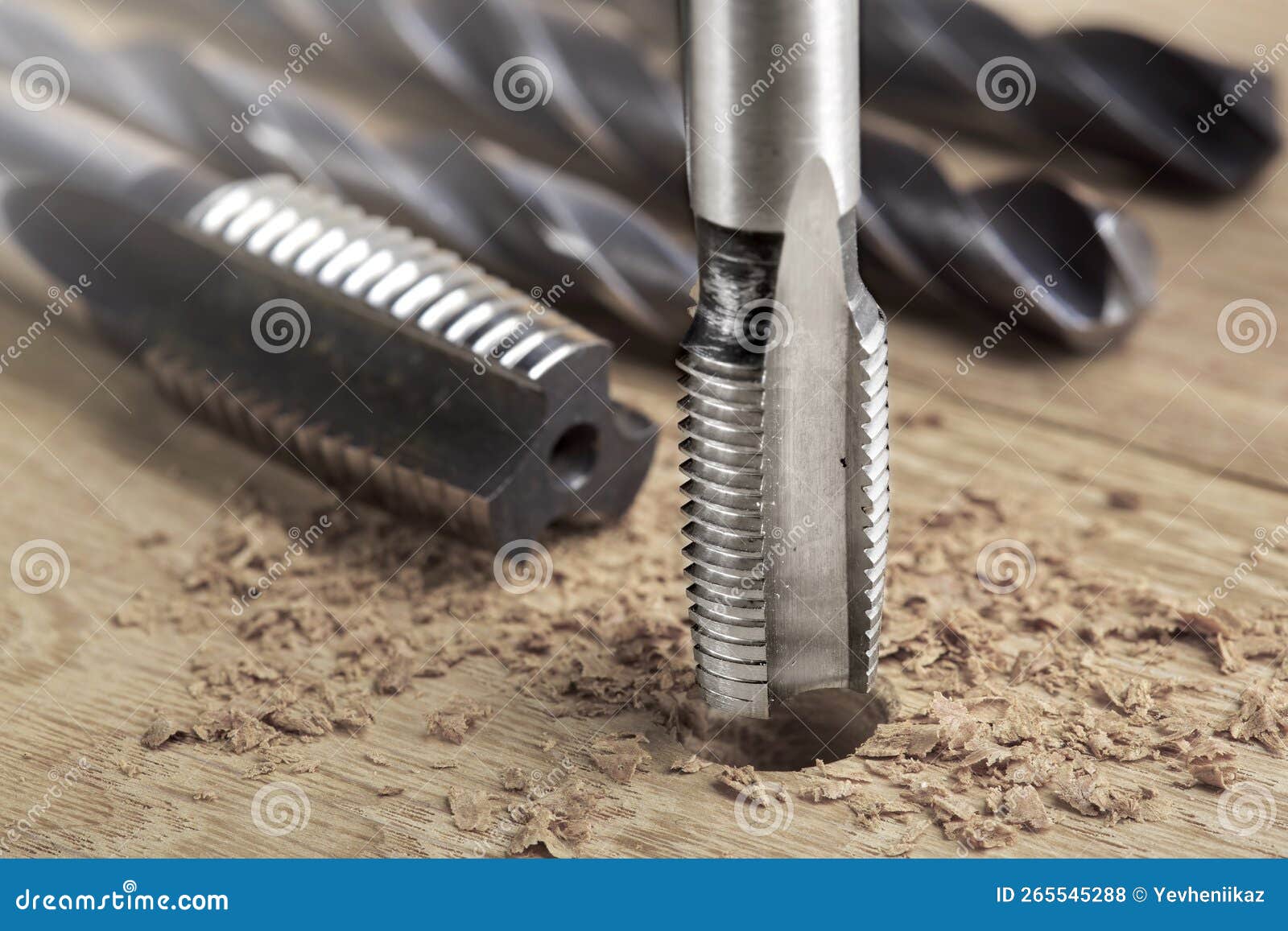 Thread Tap Drill Cutting Hole in Wooden Plate. Working Cutter Stock ...