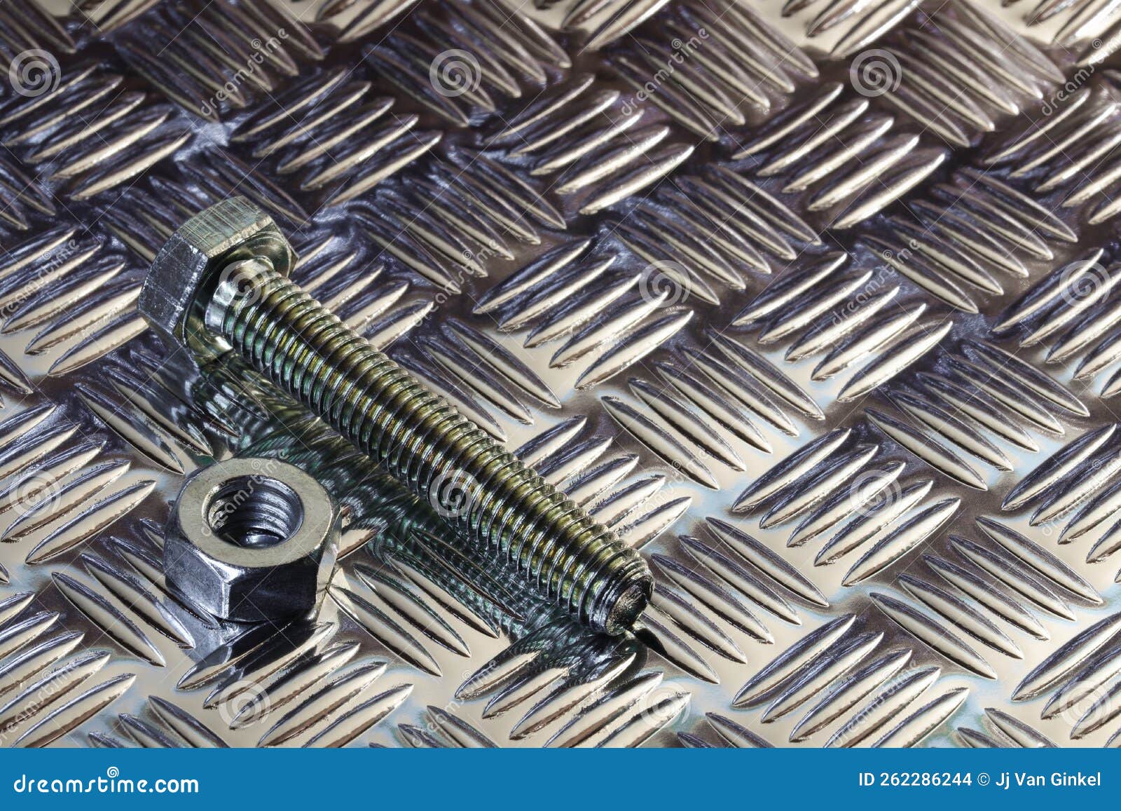 Threaded Hex Nut and Bolt on Tread Plate Stock Photo - Image of close ...