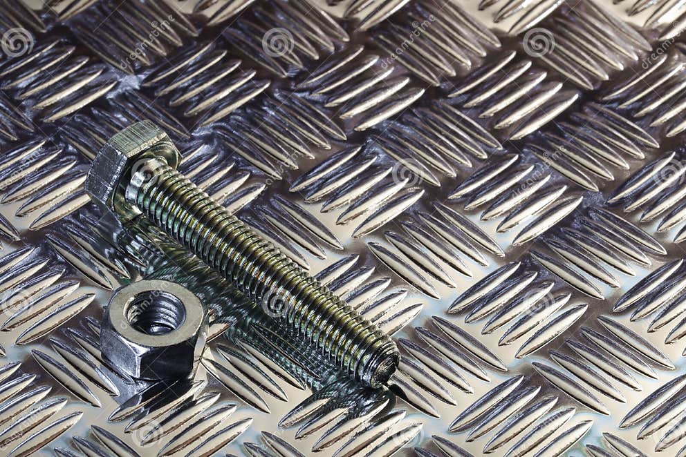 Threaded Hex Nut and Bolt on Tread Plate Stock Photo - Image of close ...
