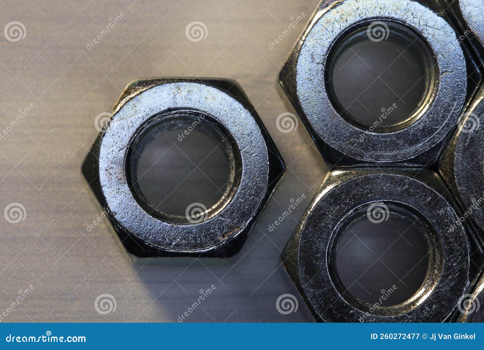 Metal Hex Nuts Close-up on Textured Surface Stock Image - Image of ...