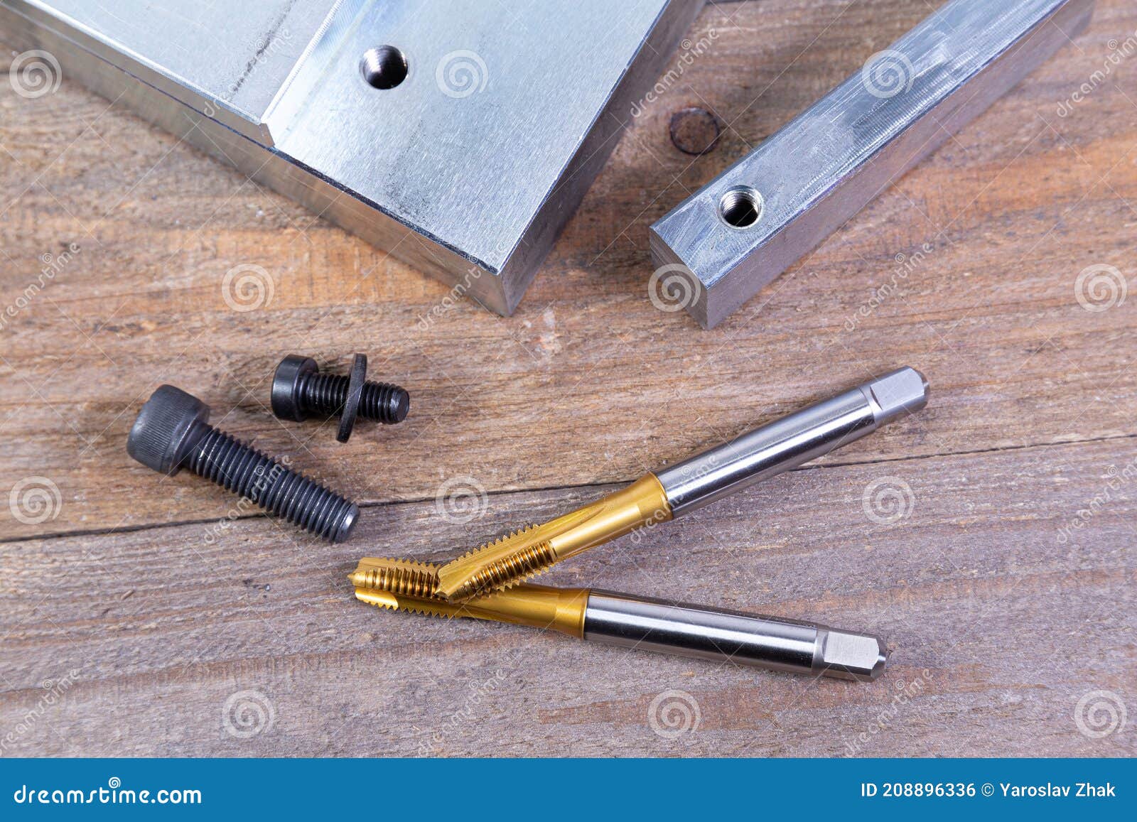 Steel Billet, Hex Bolt and Metal Taps on Wood Board. Tool for Metal ...