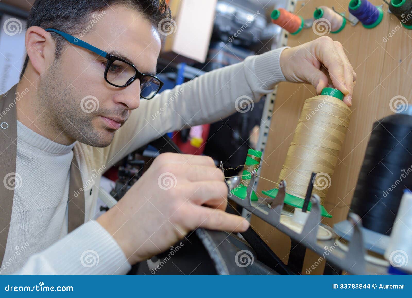 Threading Cotton on Machine Stock Photo - Image of working, fabrics ...