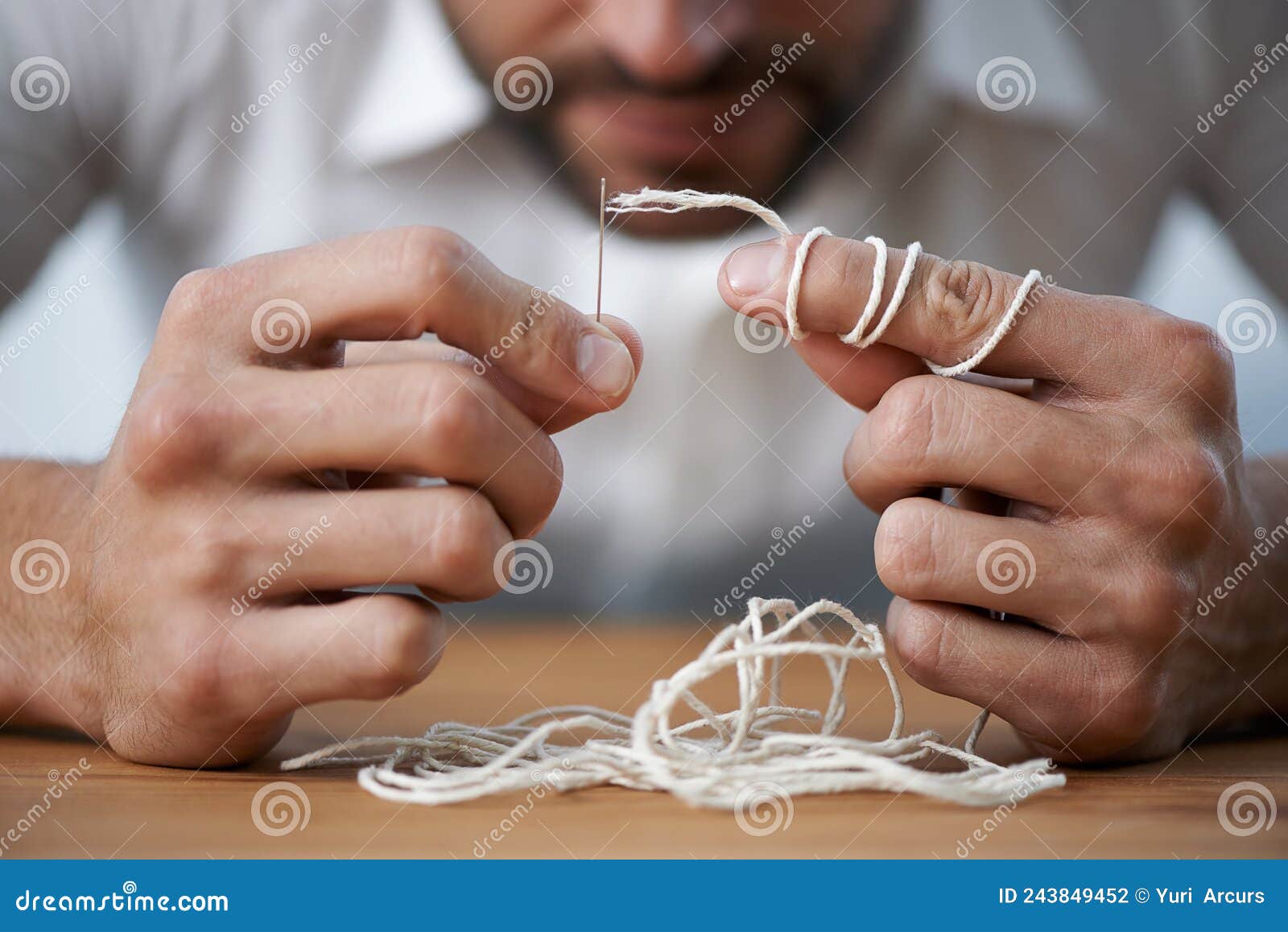 Threading a Needle. a Man Struggling To Thread String through a Needles ...