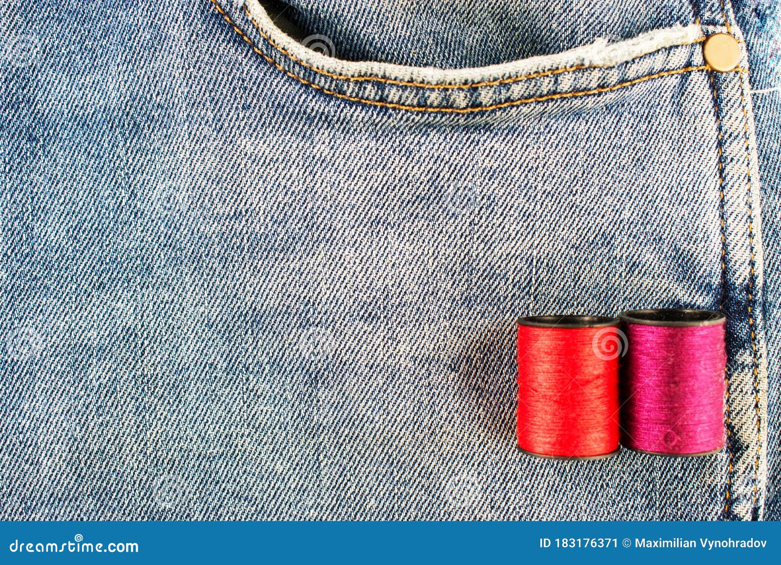 Threads on the Background of Jeans. Blue and Red Thread on the ...